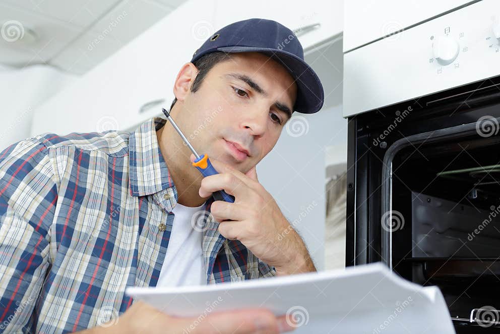 Technician reading manual stock image. Image of maintenance - 233685741