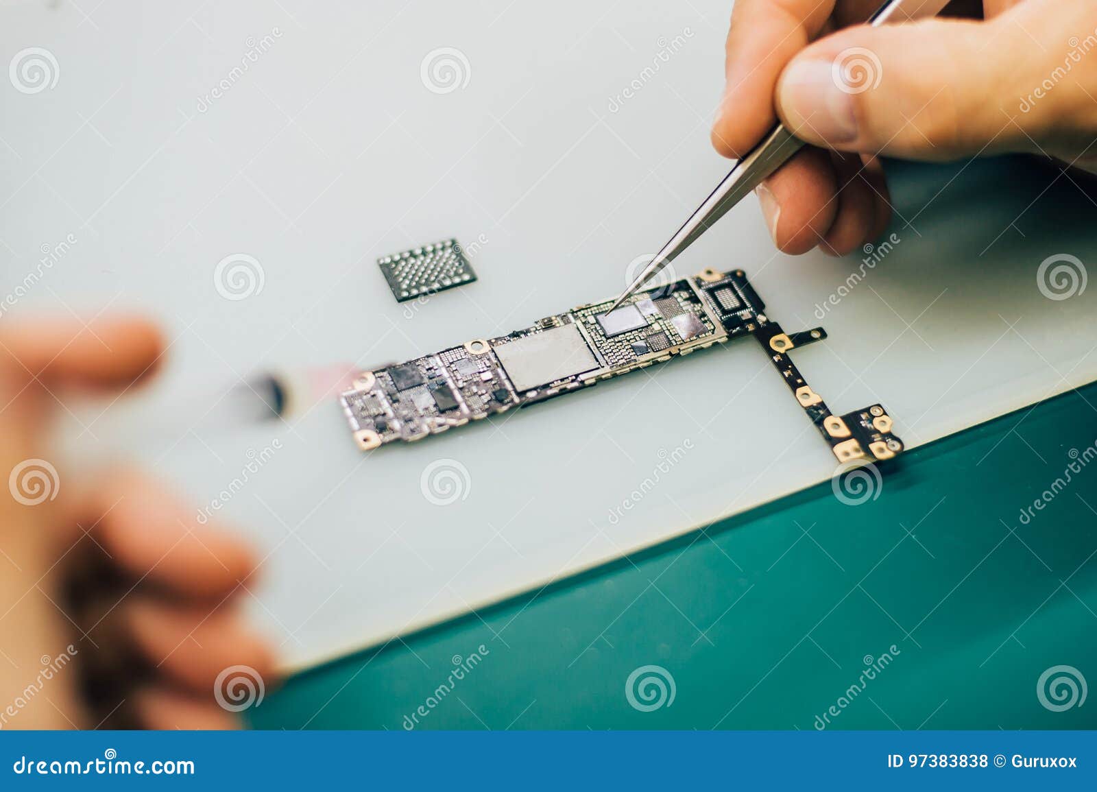 Technician Repair Microchip and Motherboard of Mobile Phone in E Stock ...