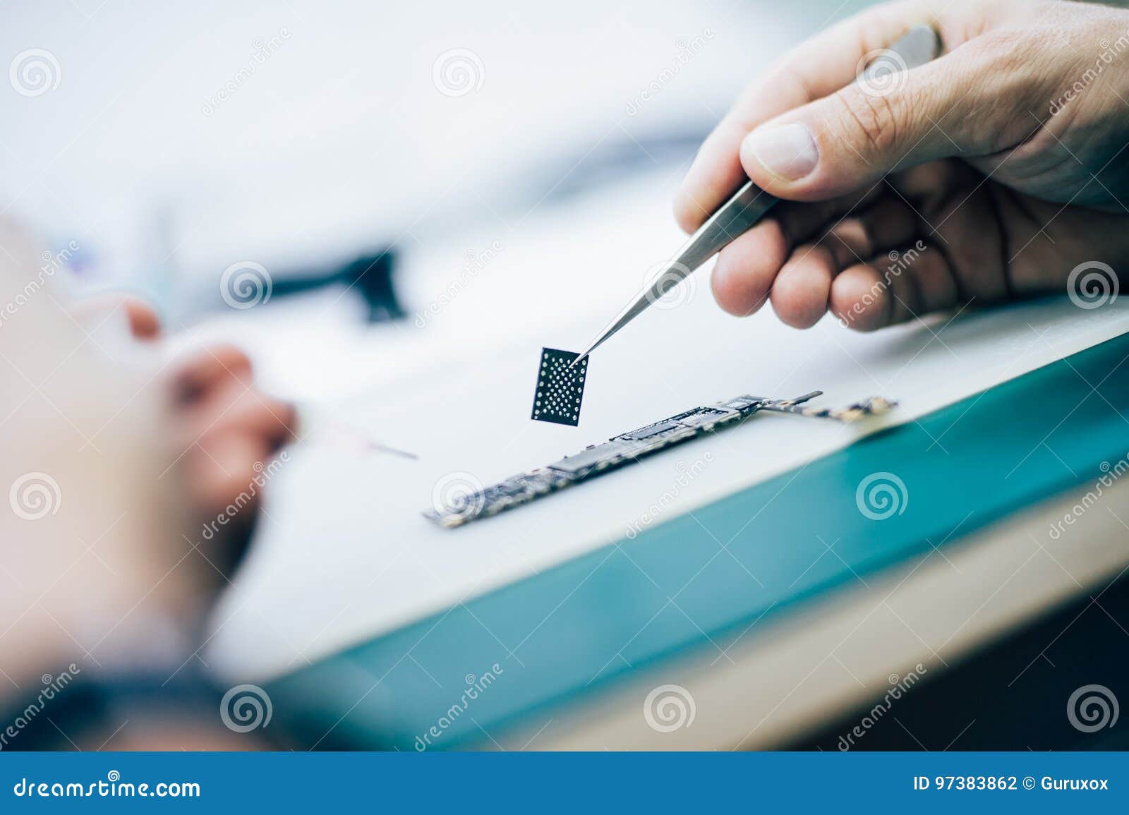 Technician Repair Microchip and Motherboard of Mobile Phone in E Stock ...