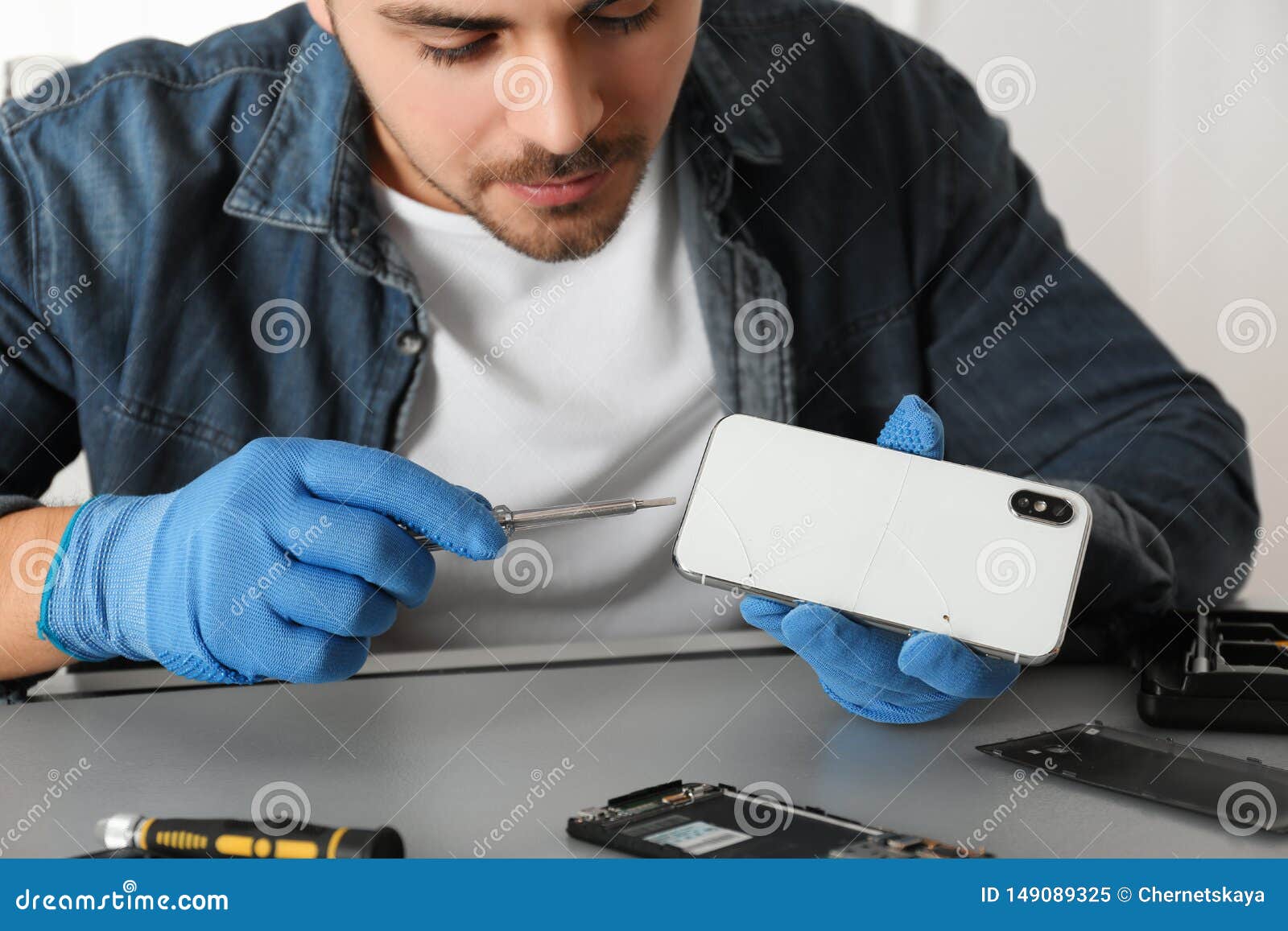Technician Repairing Broken Smartphone at Table Stock Image - Image of ...