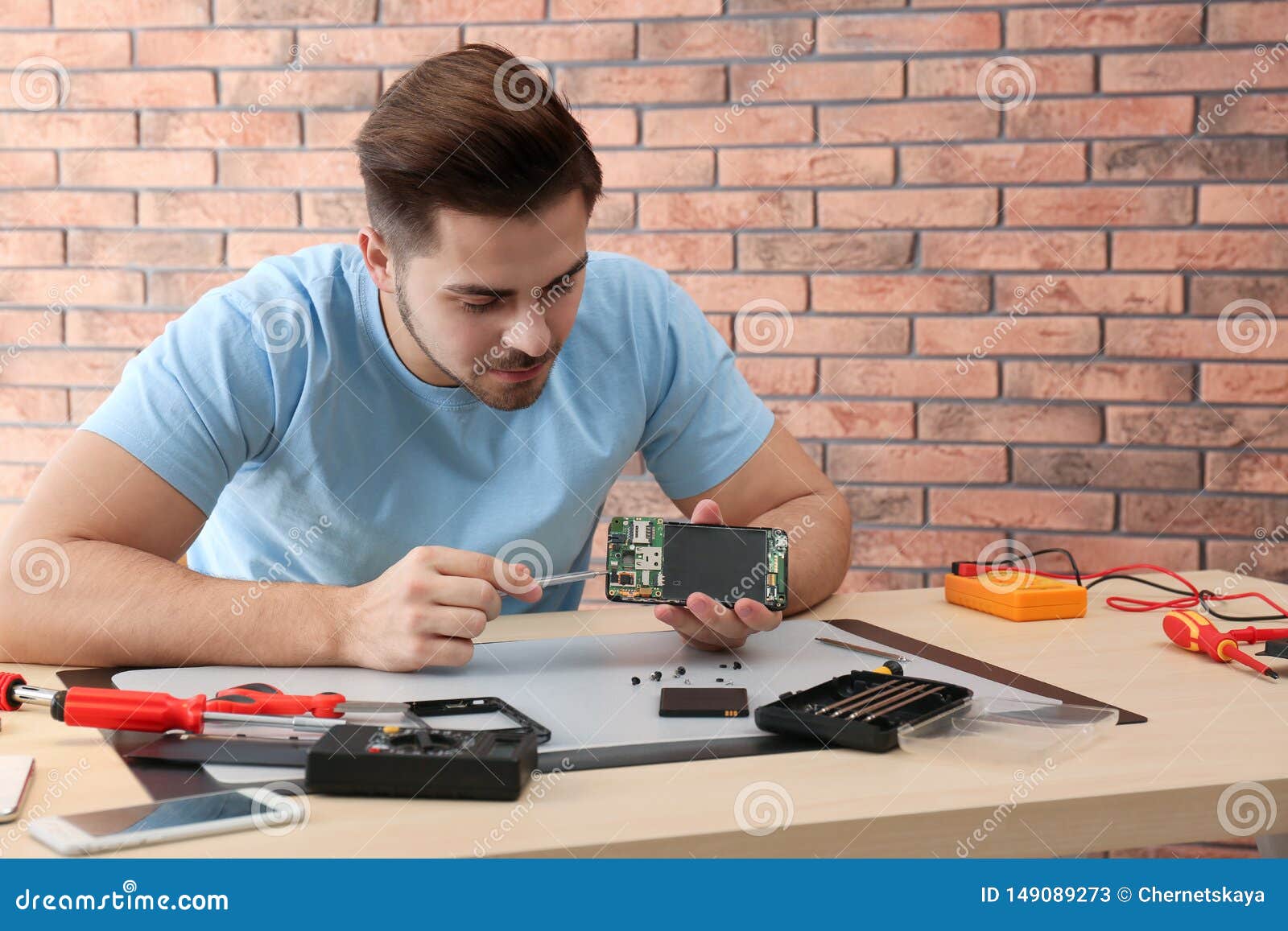 Technician Repairing Broken Smartphone at Table Stock Image - Image of ...