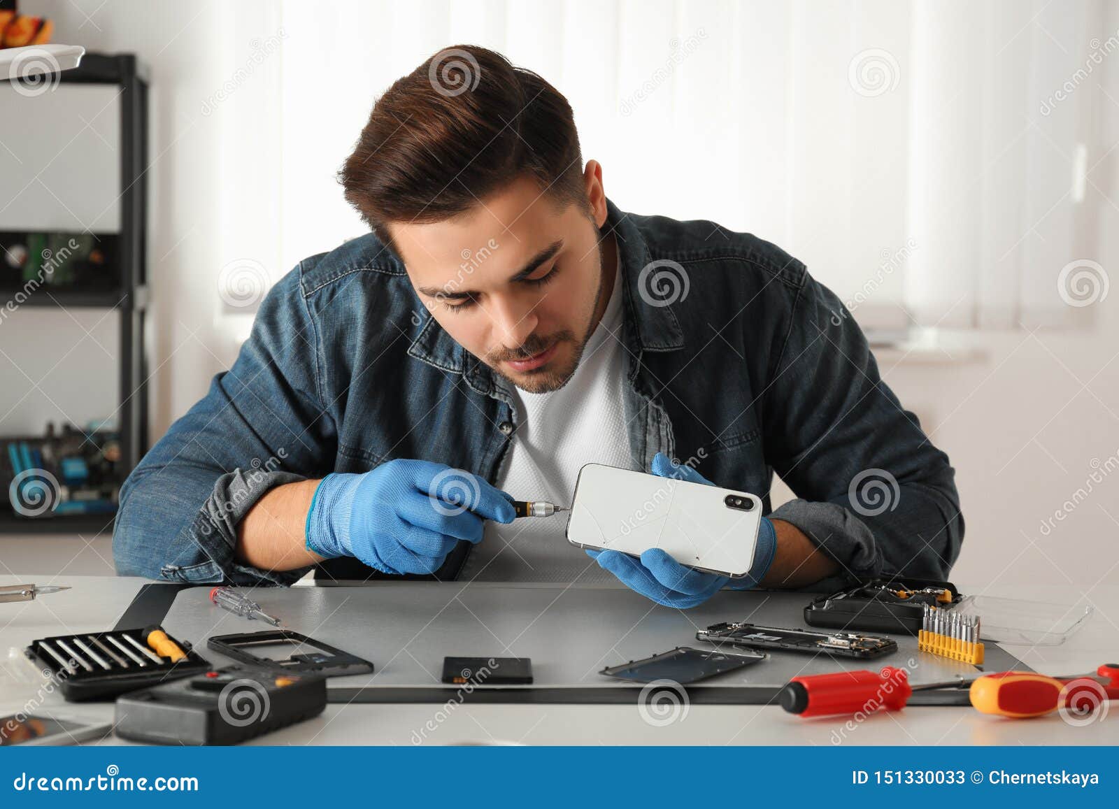Technician Repairing Broken Smartphone at Table Stock Image - Image of ...