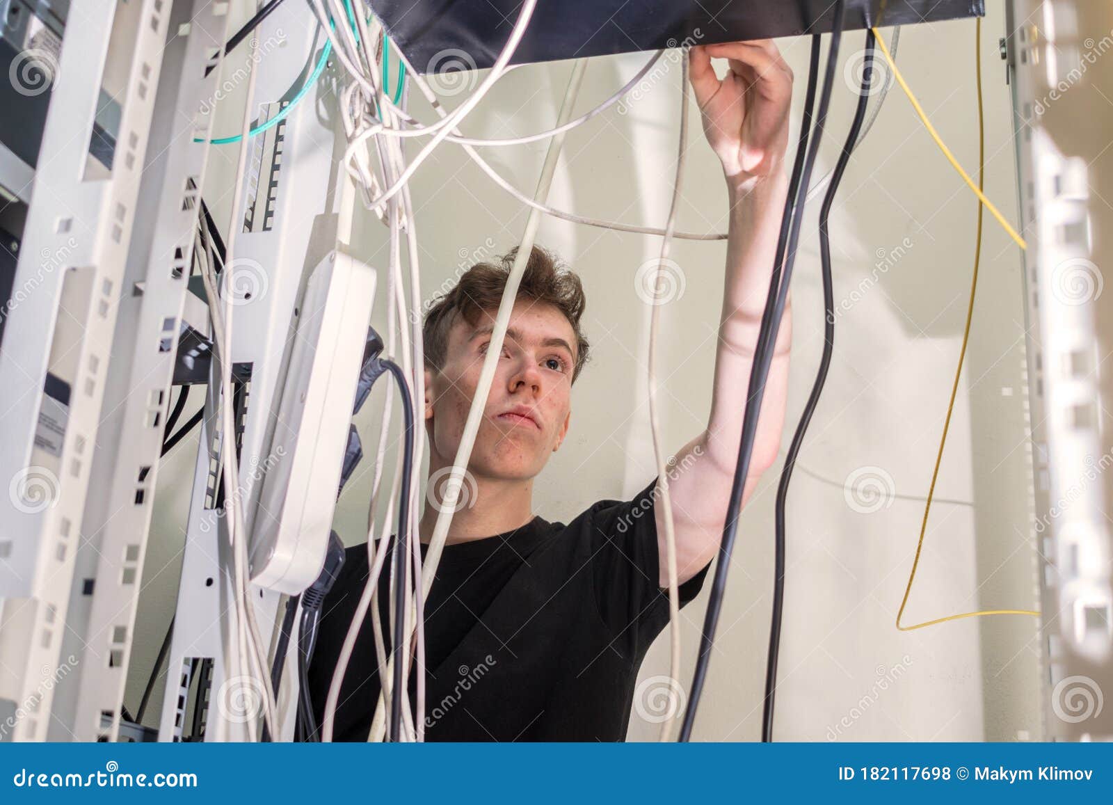Technician is Repairing Communication Cable Line. a Young Man Connects ...