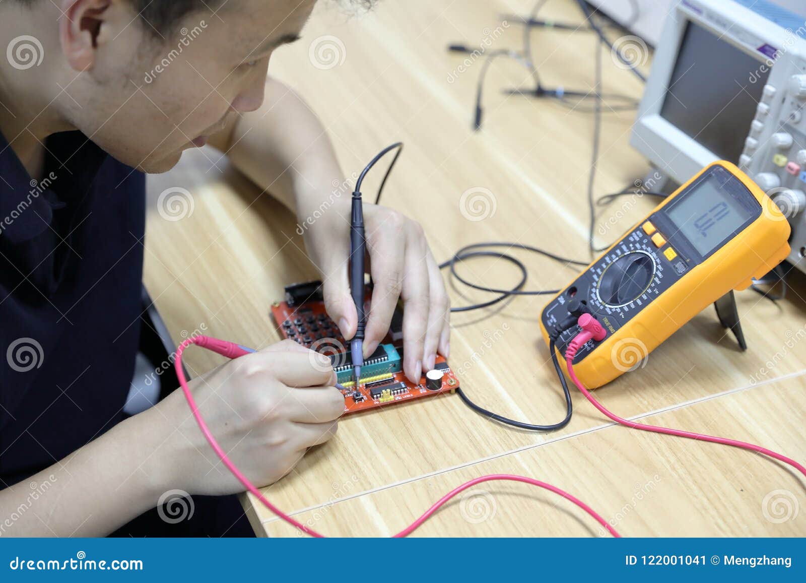 Multimeter Probes Examining a Computer Circuit Board Stock Image ...