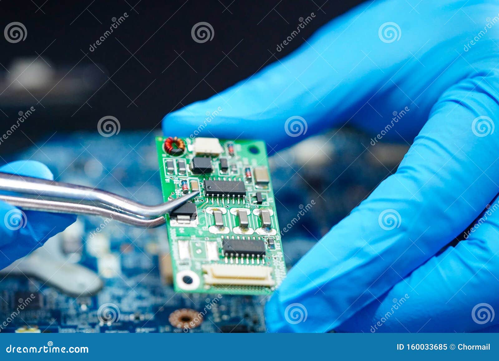 Technician Repairing Inside of Hard Disk by Soldering Iron. Integrated ...