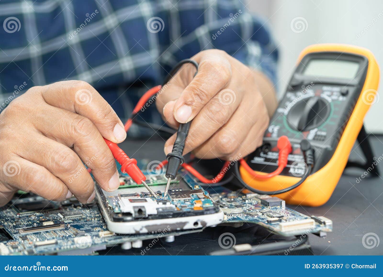 Technician Repairing Inside of Mobile Phone. Integrated Circuit. the ...