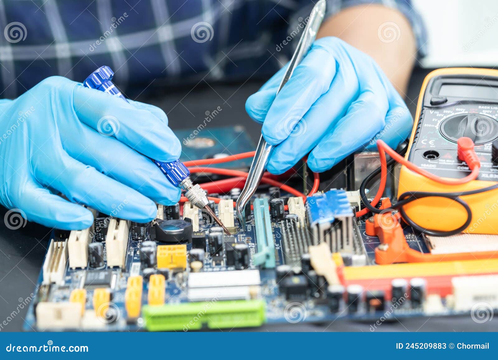 Technician Repairing Inside of Mobile Phone by Soldering Iron ...