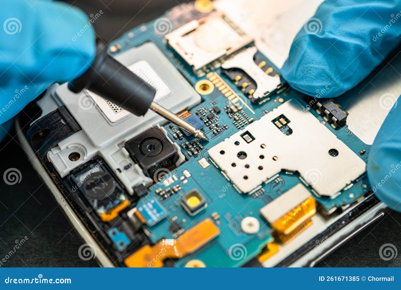 Technician Repairing Inside of Mobile Phone by Soldering Iron ...