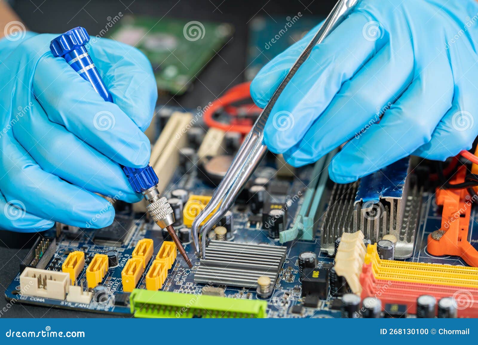 Technician Repairing Inside of Mobile Phone by Soldering Iron ...