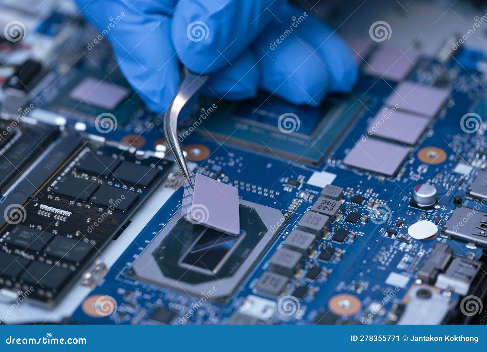 Technician Repairing Inside of Thermal Pad for Integrated Circuit. the ...