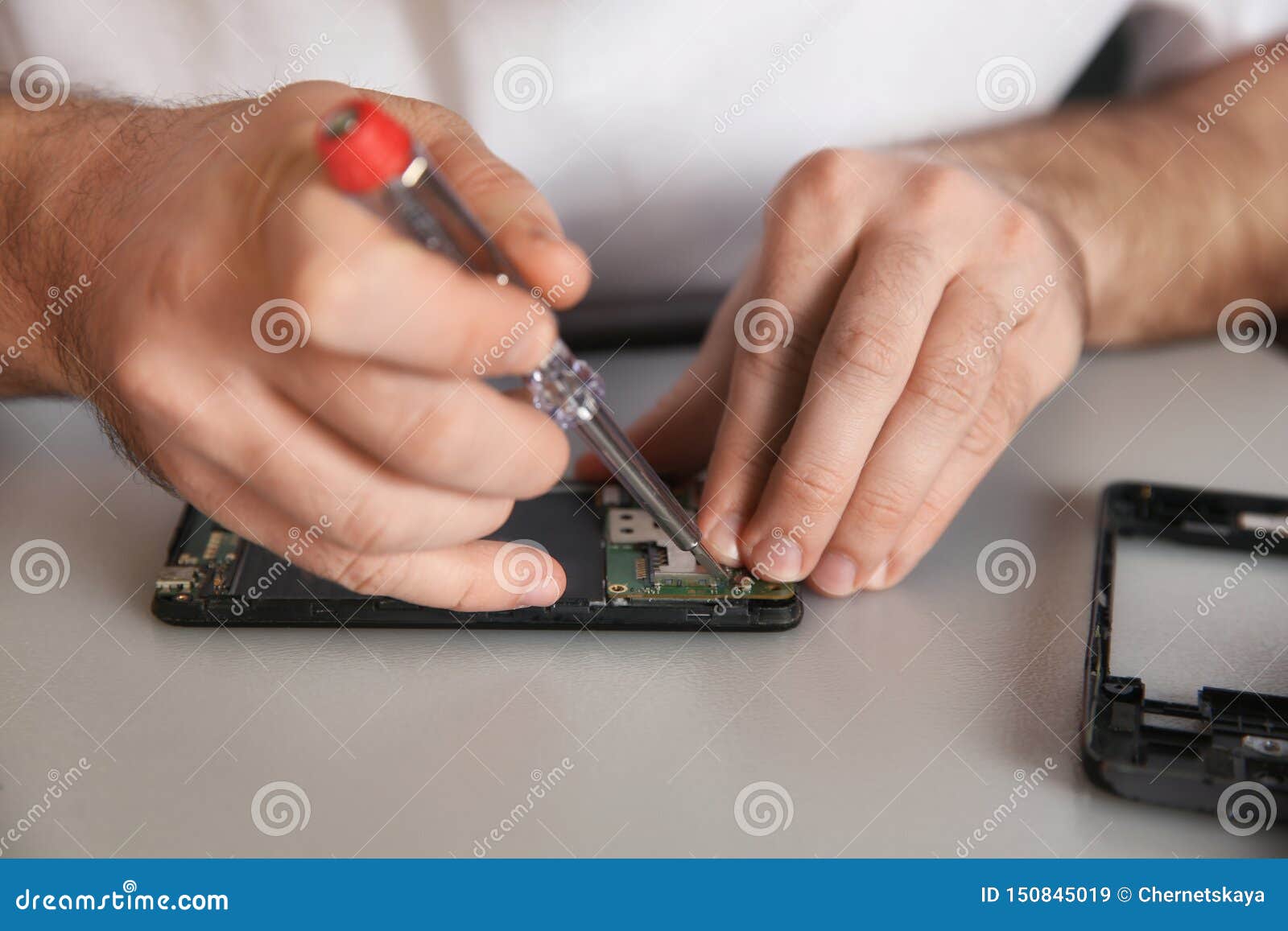Technician Repairing Mobile Phone at Table Stock Image - Image of ...