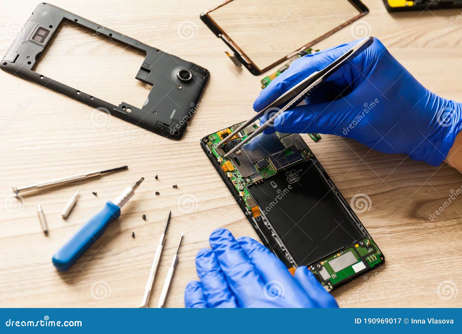 Technician Repairing Mobile Phone at Table, Closeup Stock Image - Image ...