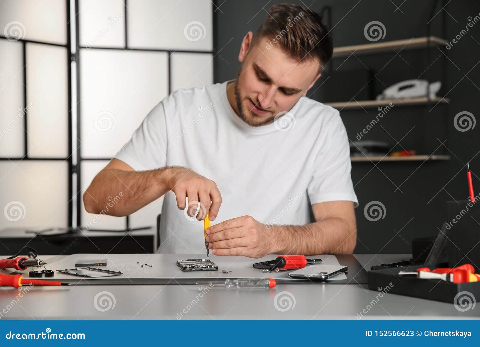 Technician Repairing Mobile Phone at Table Stock Image - Image of ...