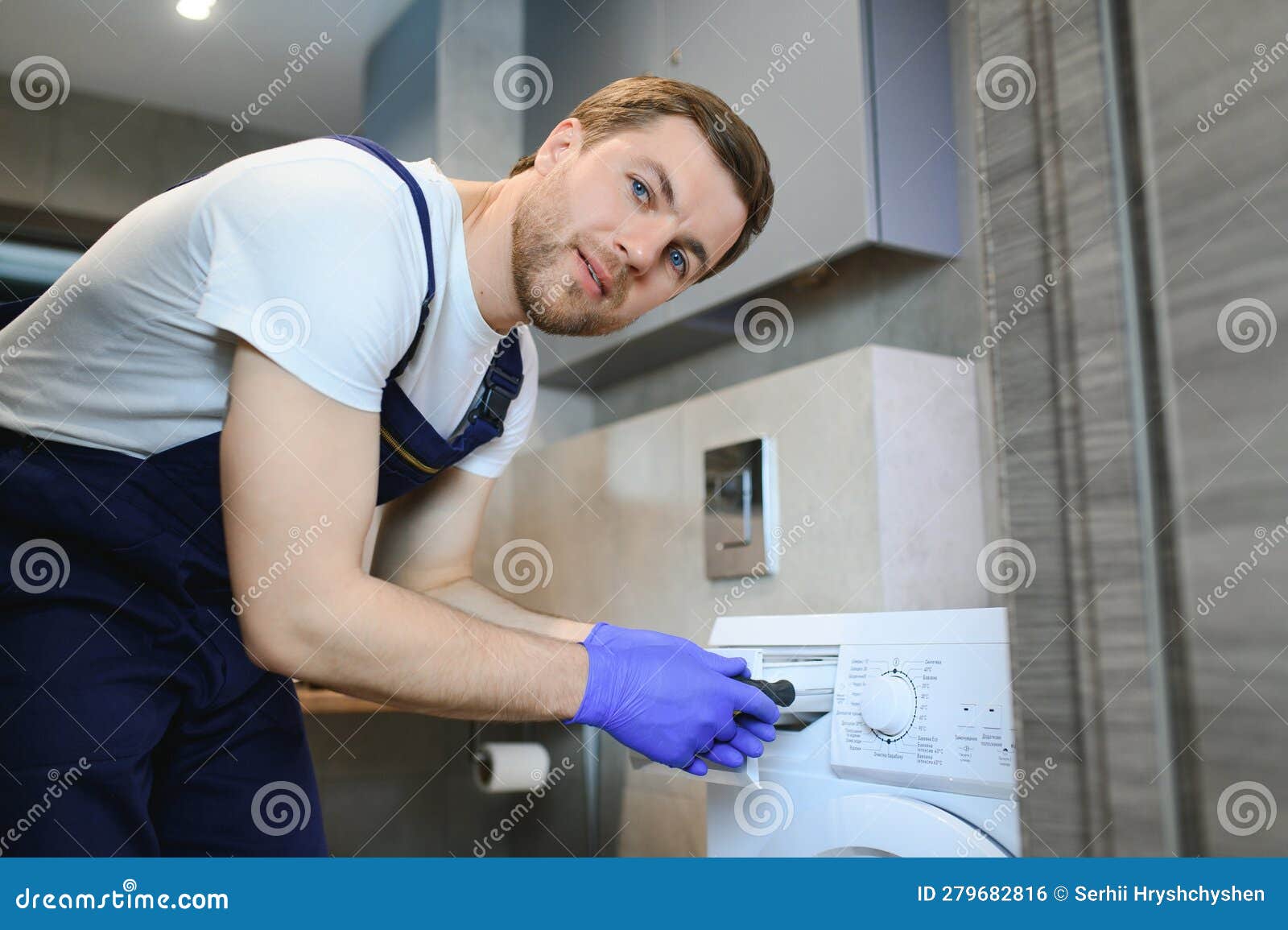 Technician Repairing a Washing Machine Stock Photo - Image of adult ...