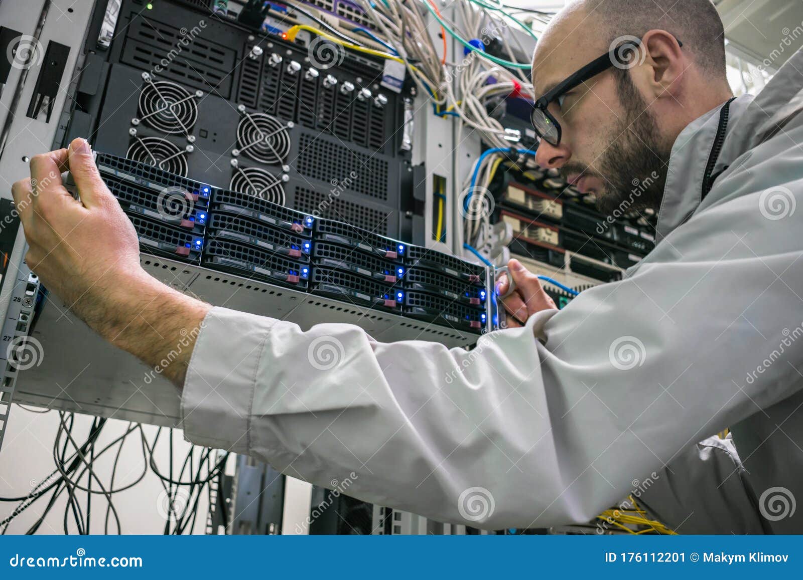 Technician Repairs the Central Router in the Datacenter Server Room ...