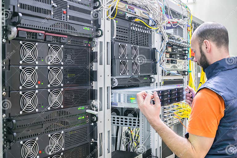 Technician Repairs the Central Router in the Datacenter Server Room ...
