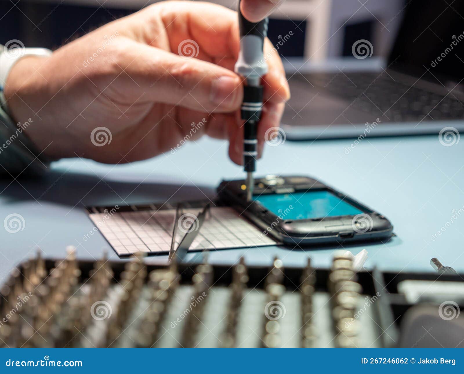 A Technician Repairs a Smartphone in a Laboratory with Copy Space ...
