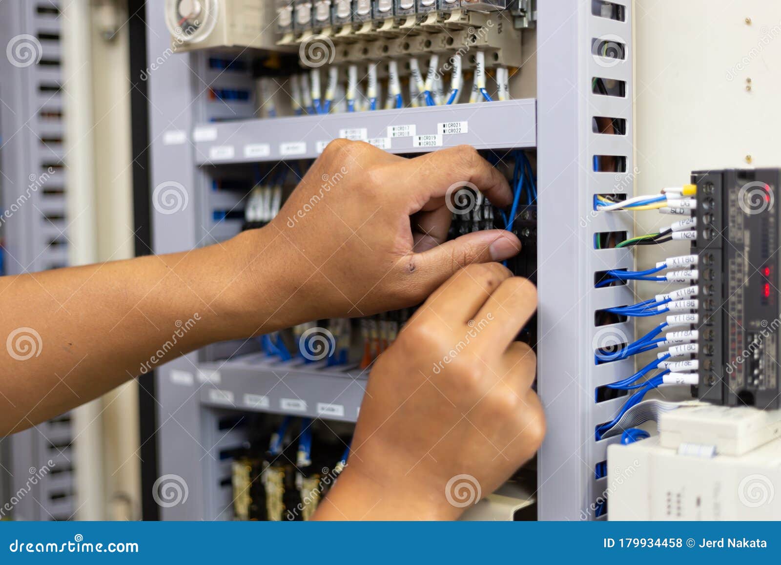 Technician Setting Electric Control Box of Machine in Factory Stock ...