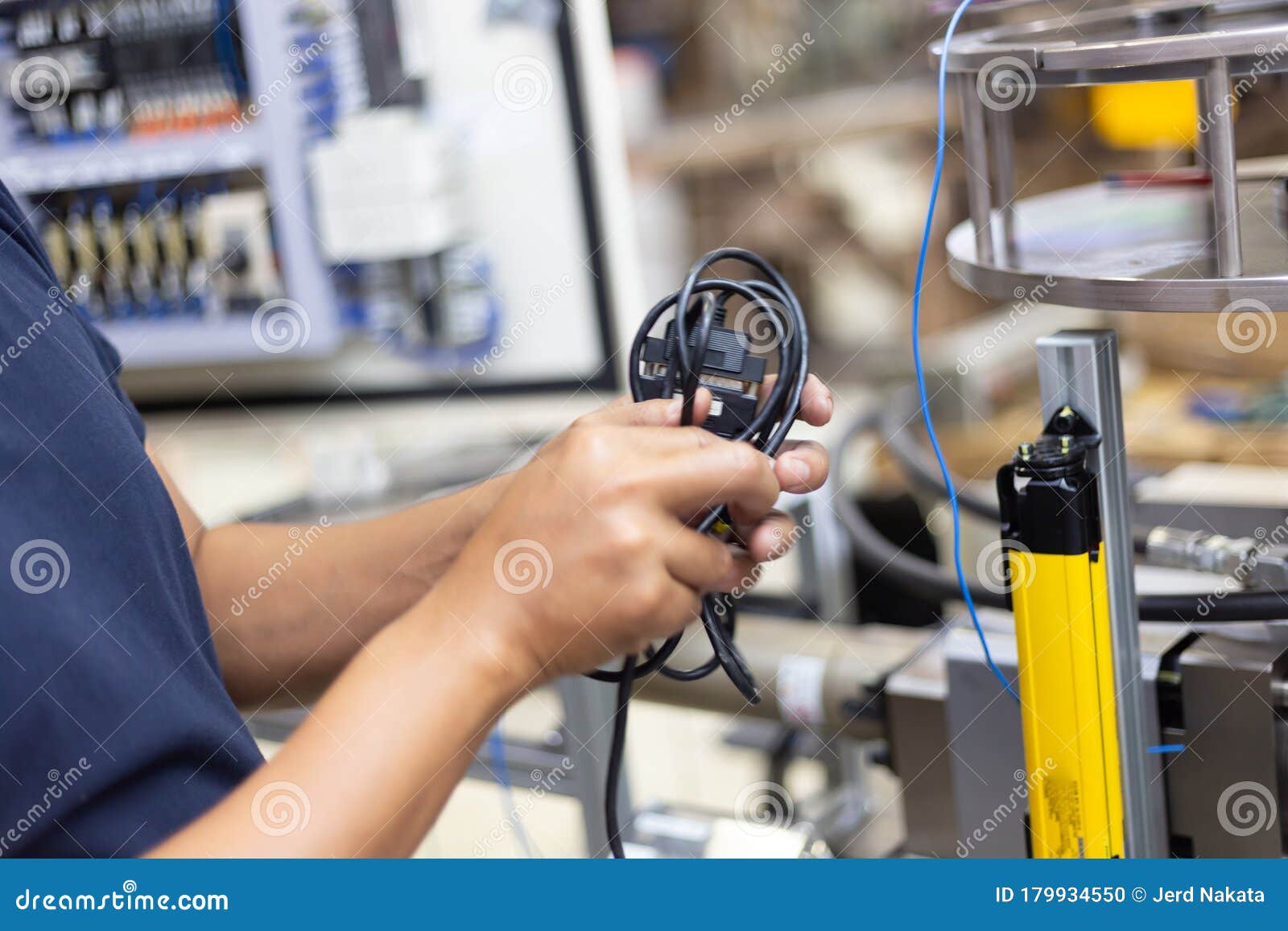 Technician Setting Electric Control Box of Machine in Factory Stock ...