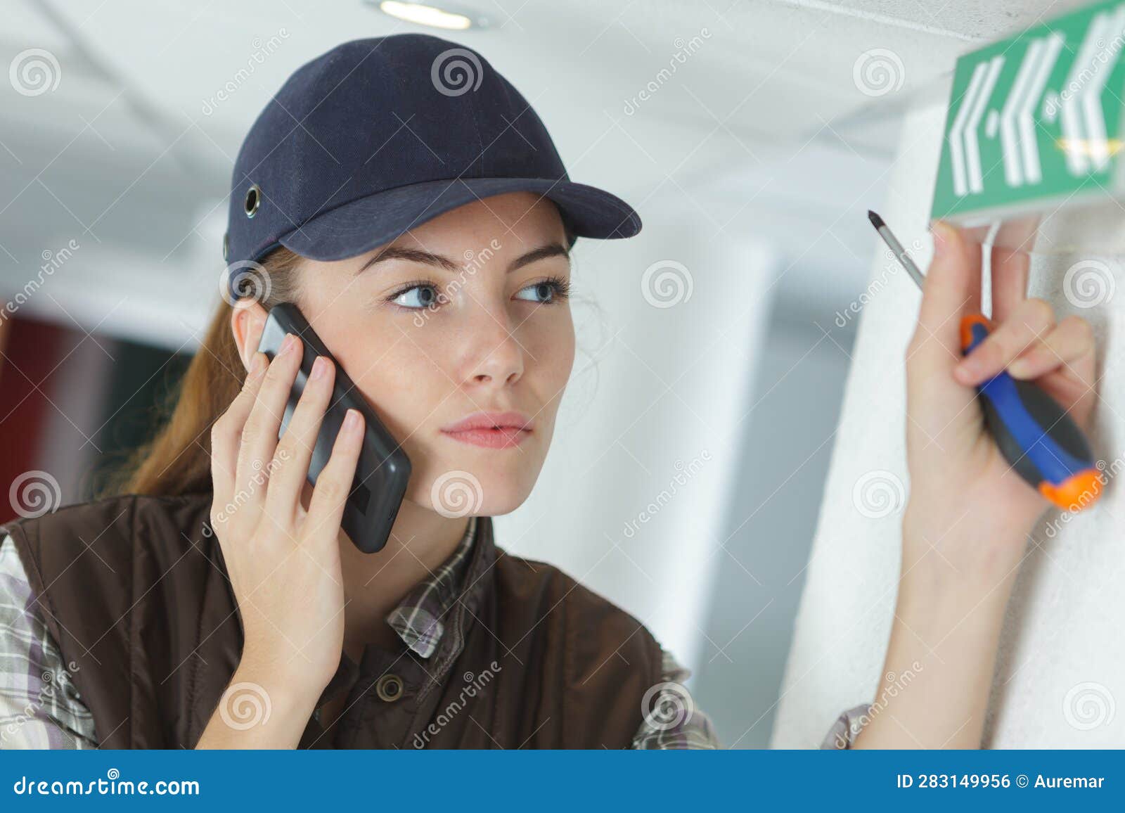 Technician Talking on Mobile Phone Stock Photo - Image of laptop, woman ...