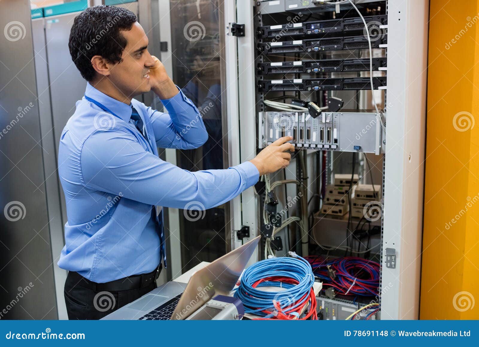 Technician Talking on Mobile Phone Stock Photo - Image of computer ...