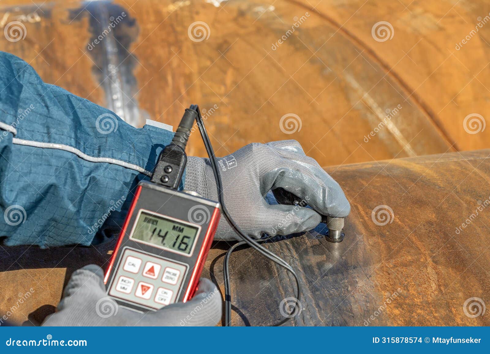 Technician Is Testing To Pipe Thickness With Ultrasonic Test Method ... Technician Is Testing To Pipe Thickness With Ultrasonic Test Method ...
