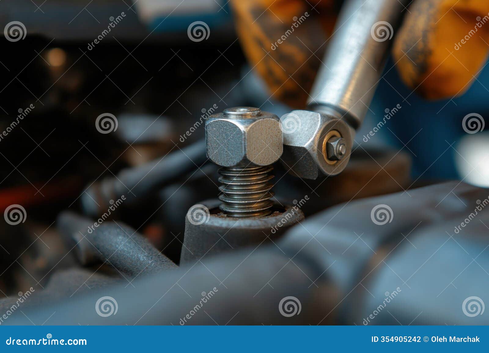 Tightening a Nut and Bolt in an Engine Assembly during Routine ...