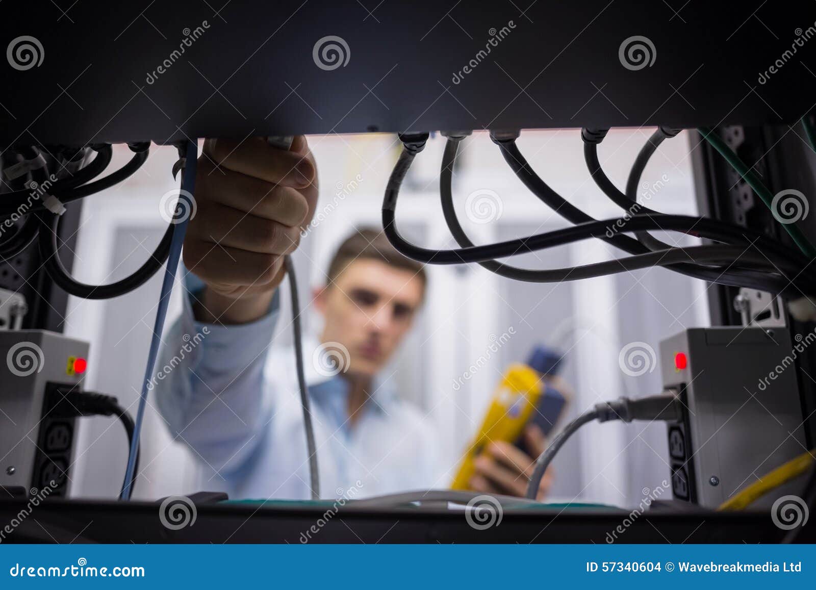 Technician Using Cable Tester while Fixing Server Stock Photo - Image ...