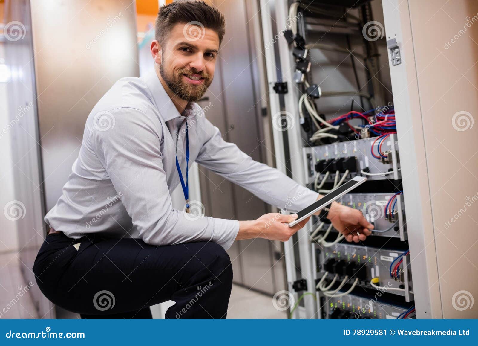 Technician Using Digital Tablet while Analyzing Server Stock Image ...