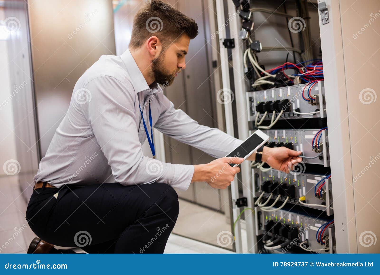 Technician Using Digital Tablet while Analyzing Server Stock Image ...
