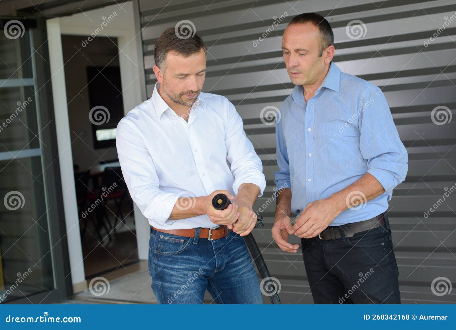 Technician Using Digital Tablet To Check Fire Extinguisher Stock Photo ...