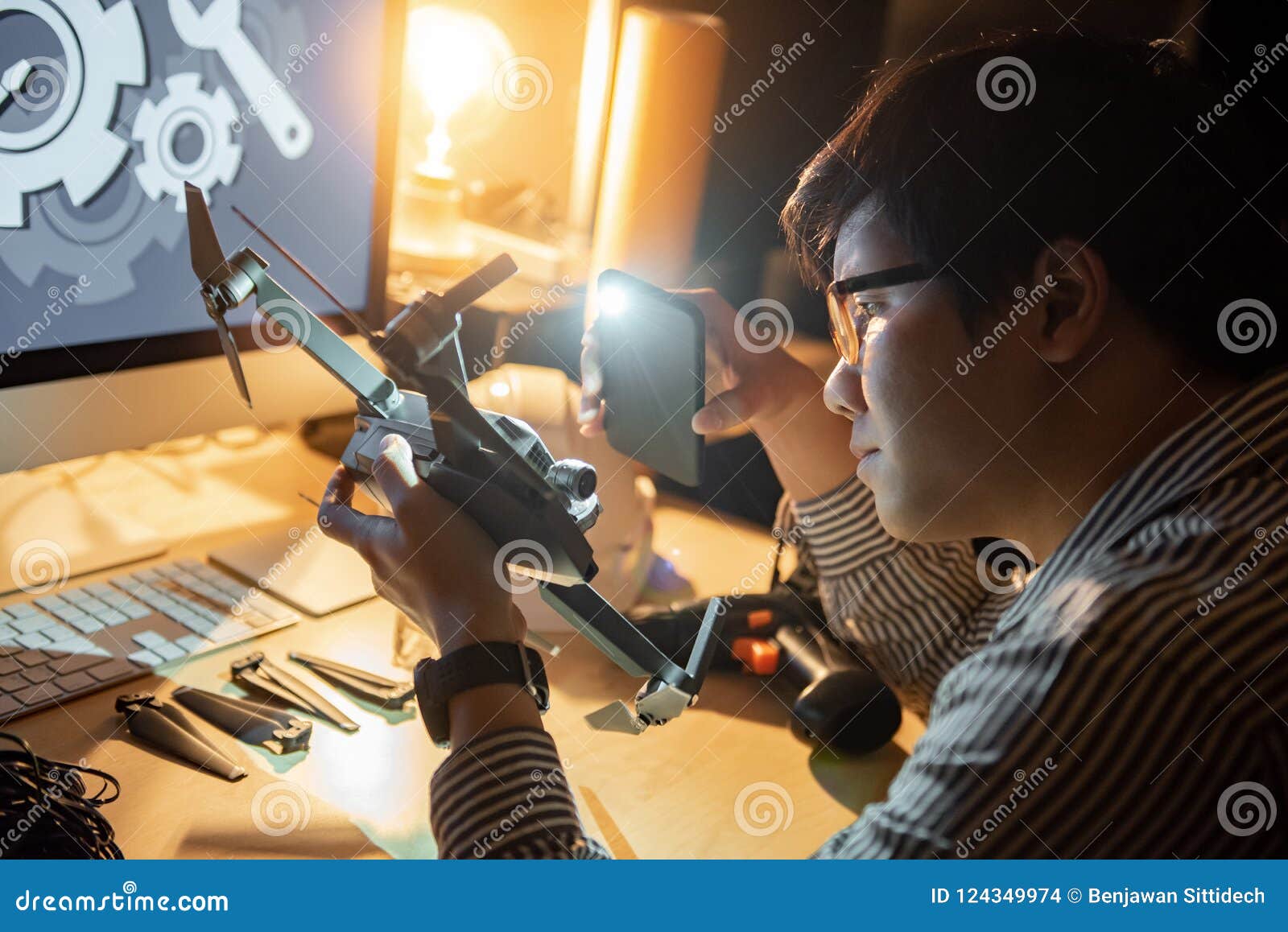Technician Using Flashlight from Smartphone for Checking Drone Stock ...