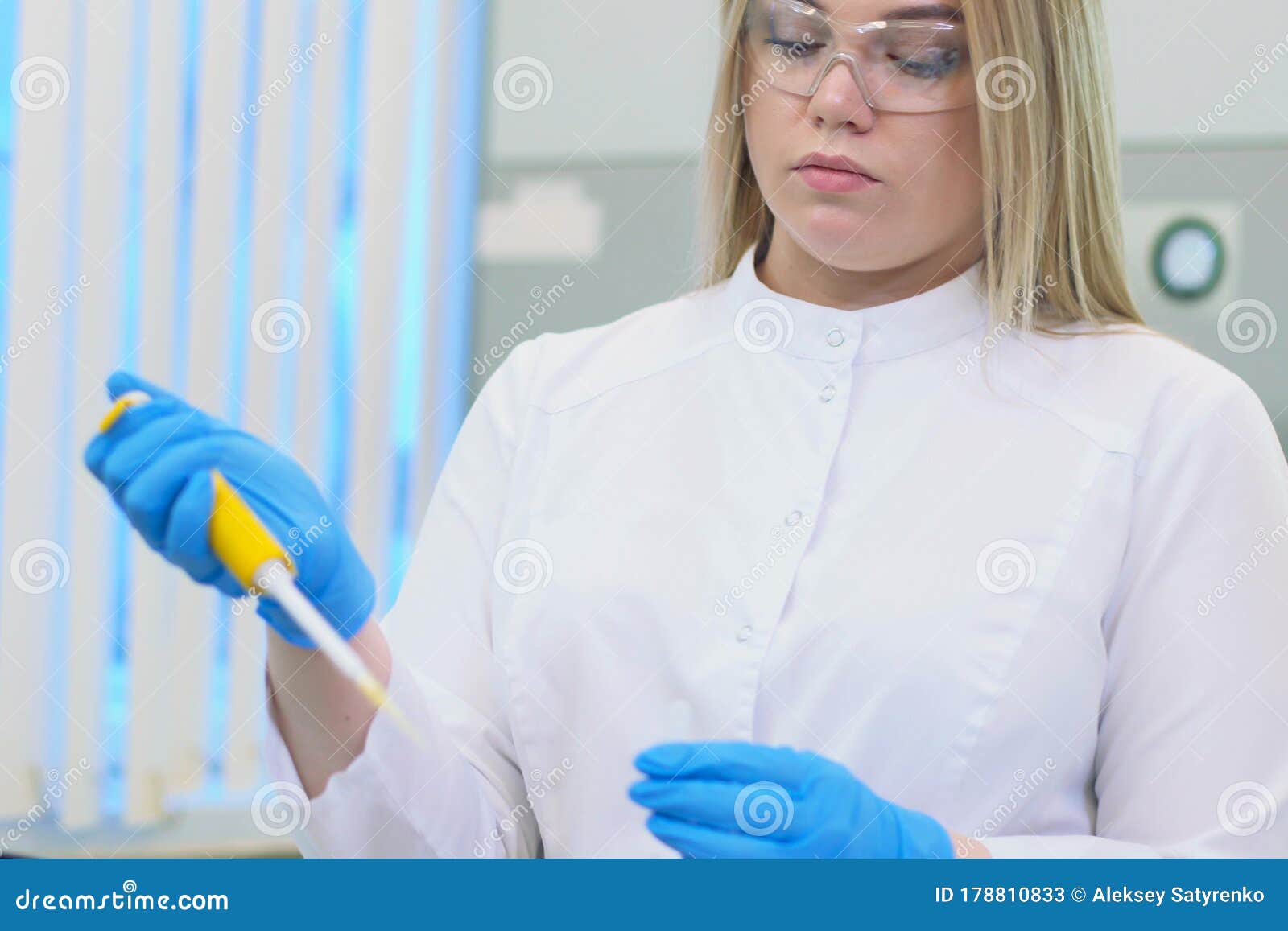 Technician Using Laboratory Pipette and Loading Samples To a Cen Stock ...
