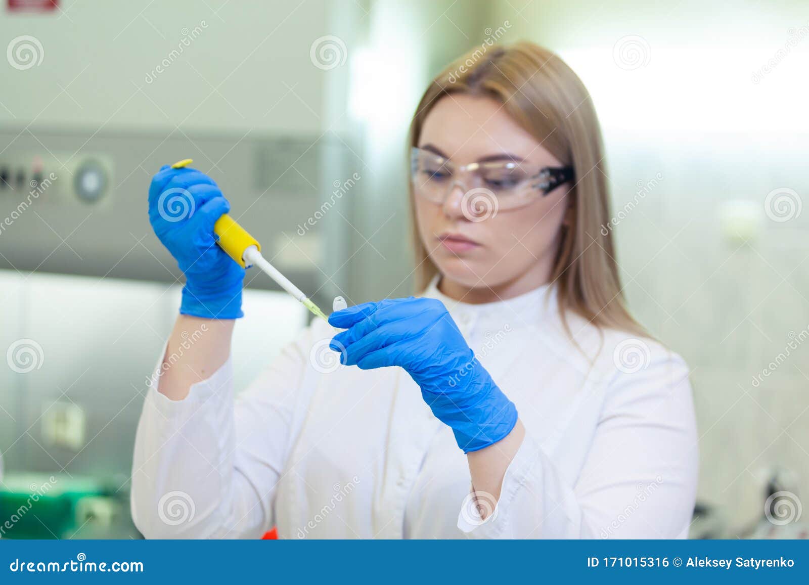 Technician Using Laboratory Pipette and Loading Samples To a Centrifuge ...