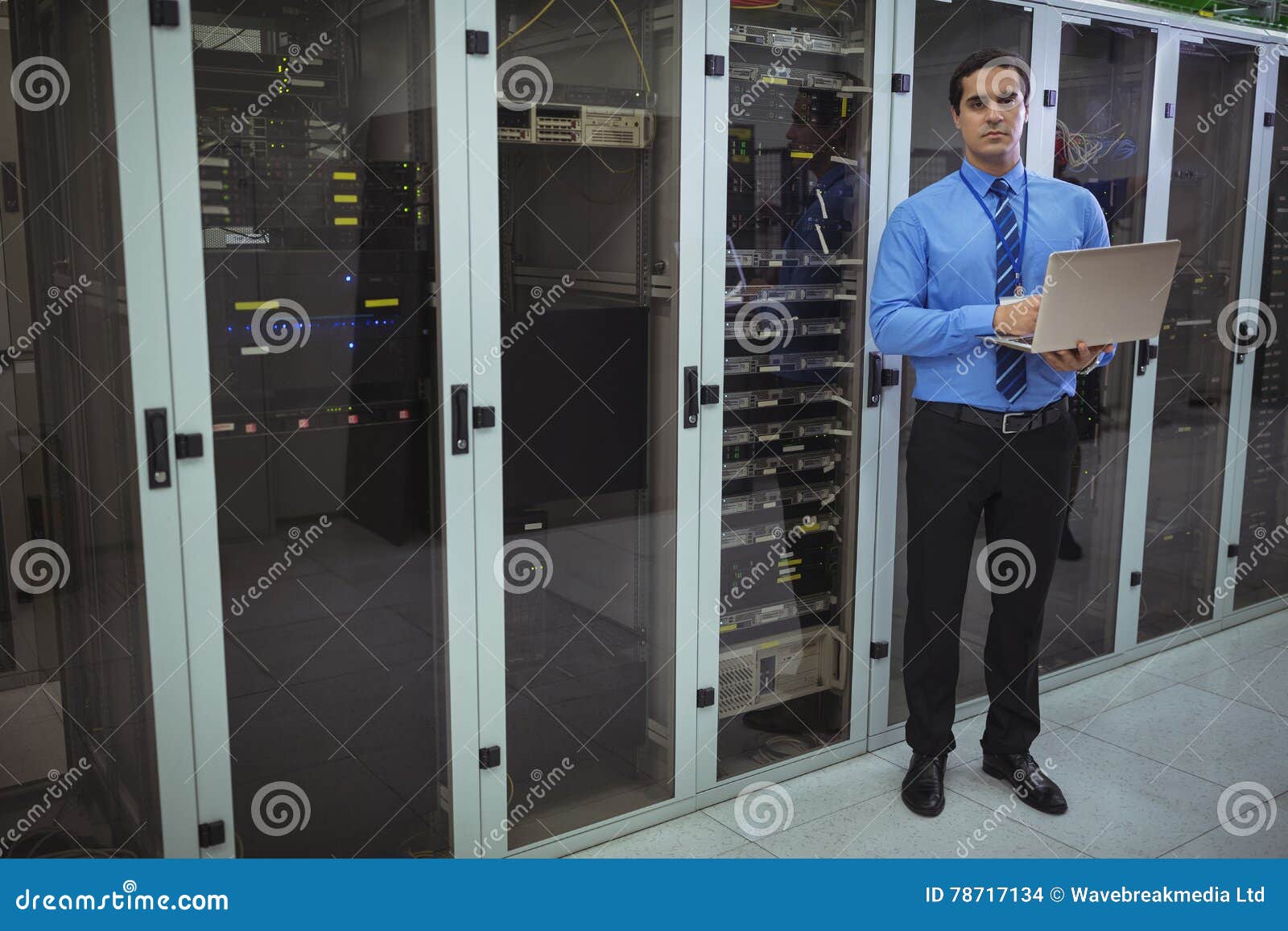 Technician Using Laptop while Analyzing Server Stock Photo - Image of ...