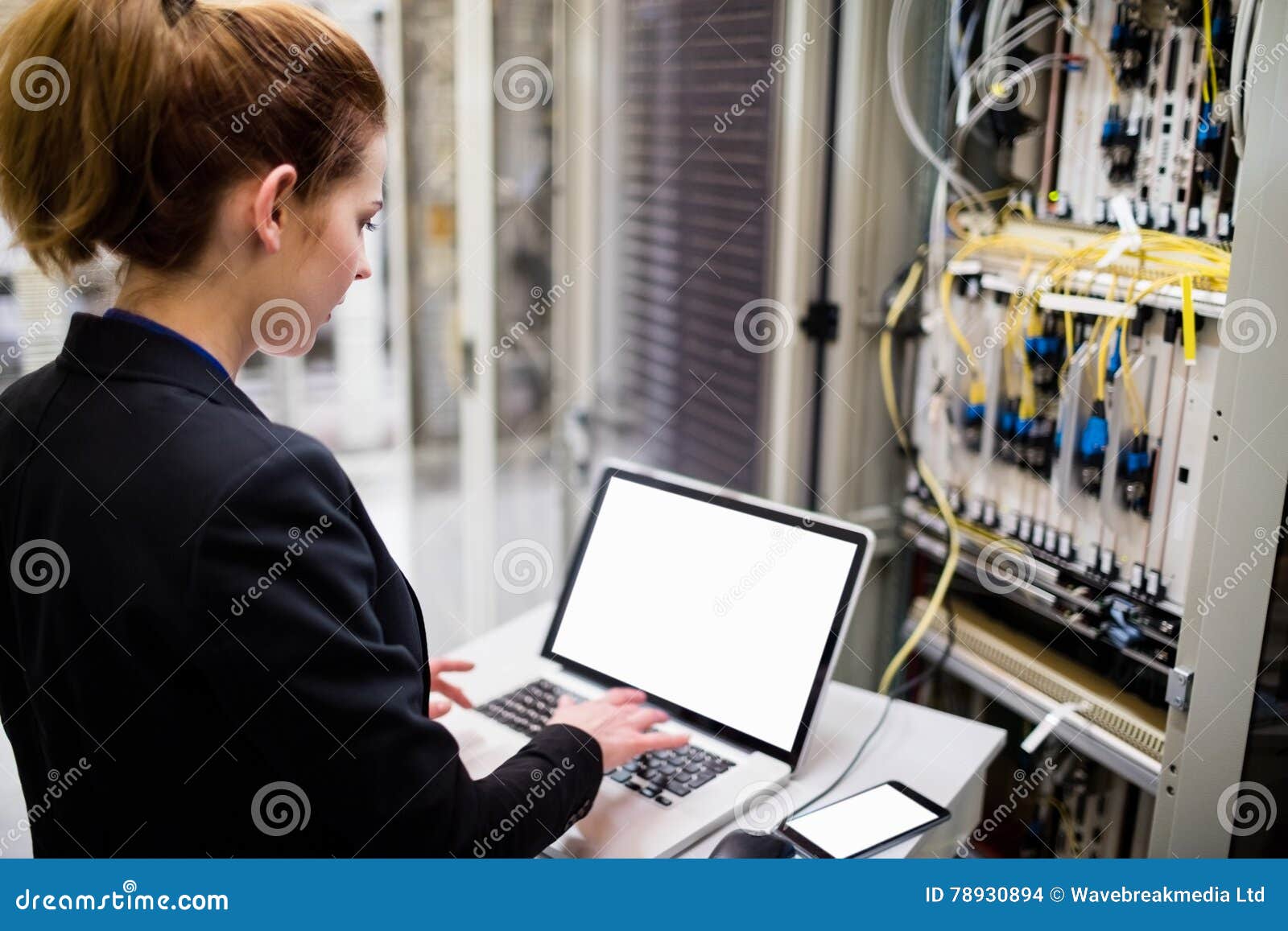 Technician Using Laptop while Analyzing Server Stock Photo - Image of ...