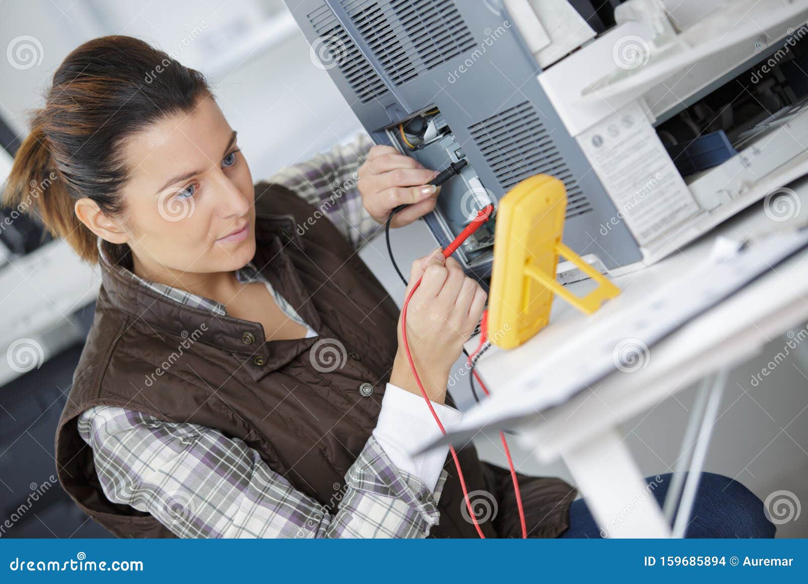 Technician Using Multimeter on Appliance Stock Photo - Image of ...