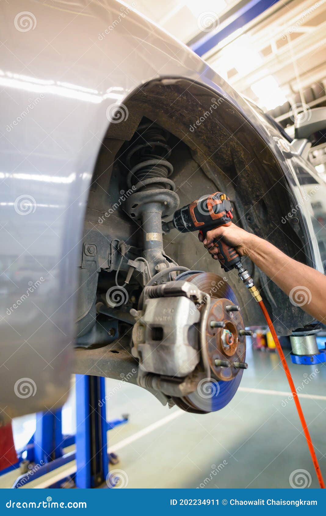 The Technician is Using Pneumatic Nut Tightening Machinel Stock Image ...