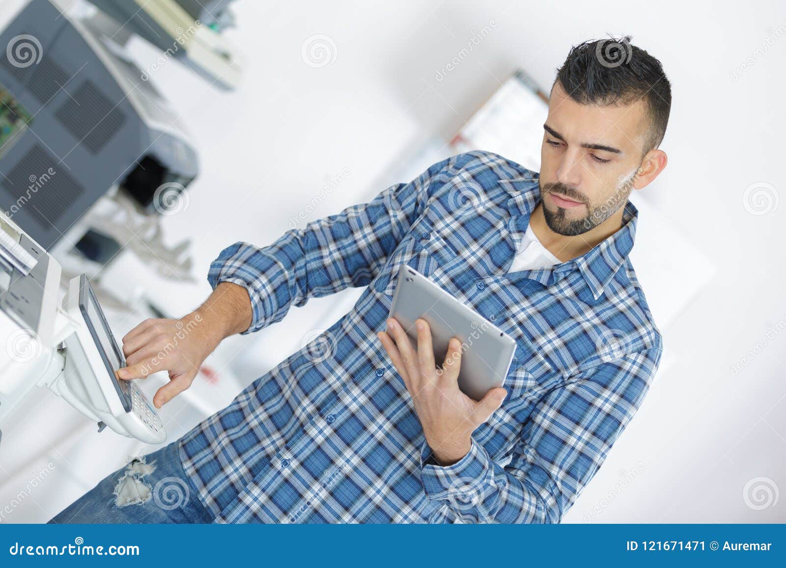 Technician Using Tablet while Analysing Server at Data Centre Stock ...