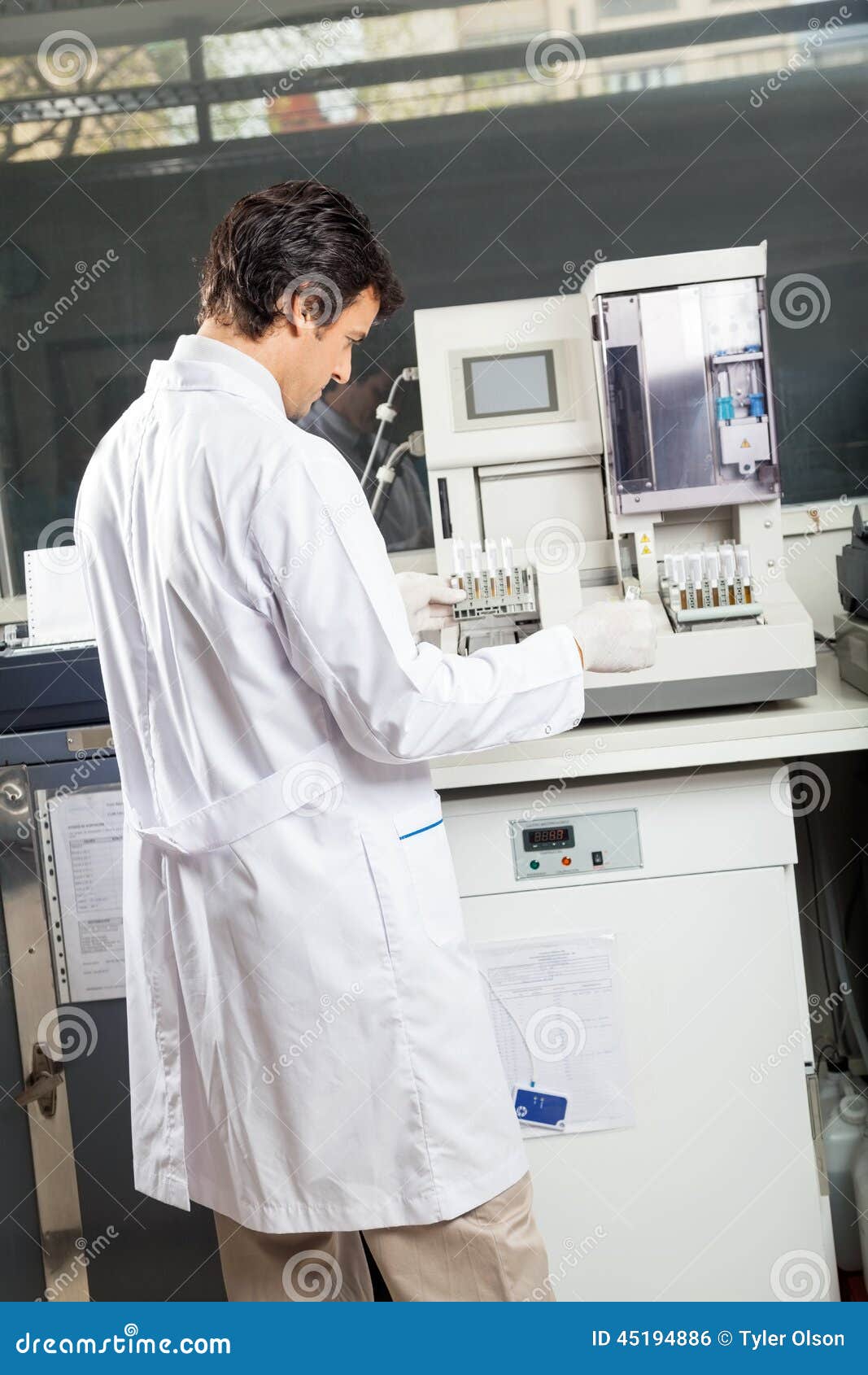 Technician Using Urine Analyzer in Lab Stock Photo - Image of ...