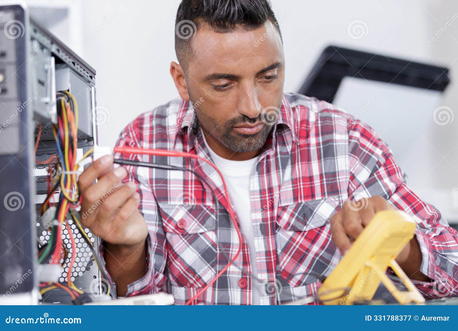Technician Using Voltage Meter for Voltage Measurement in Computer ...