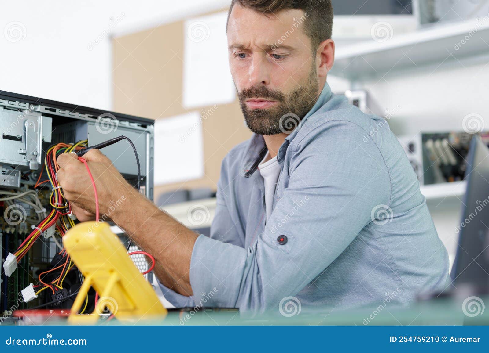 Technician Using Voltage Meter for Voltage To Fix Pc Stock Photo ...
