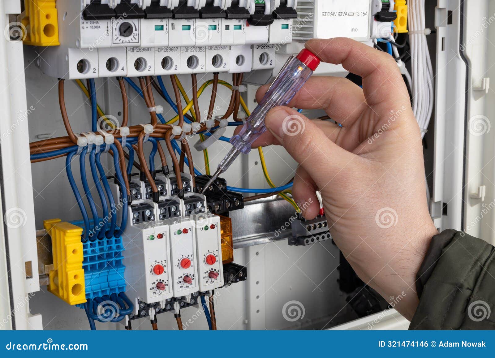 Technician Using Voltage Tester on Wiring Stock Photo - Image of ...