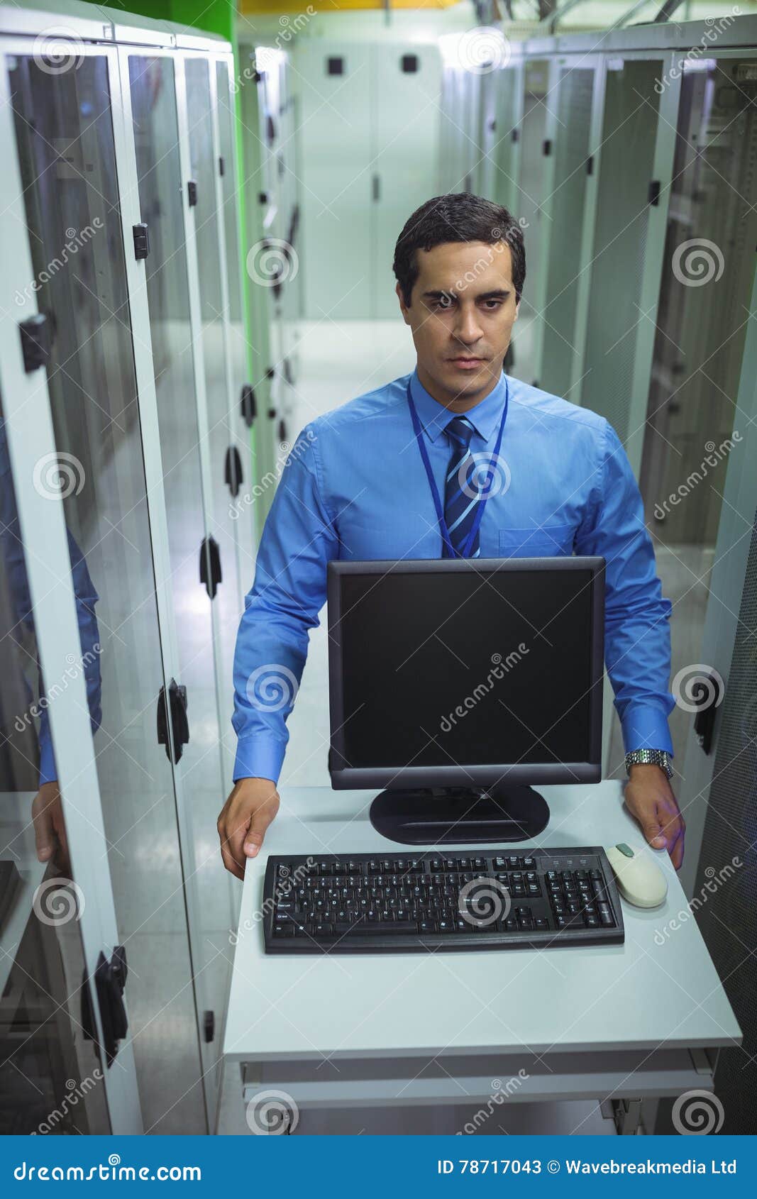 Technician Walking with Personal Computer in Hallway Stock Image ...