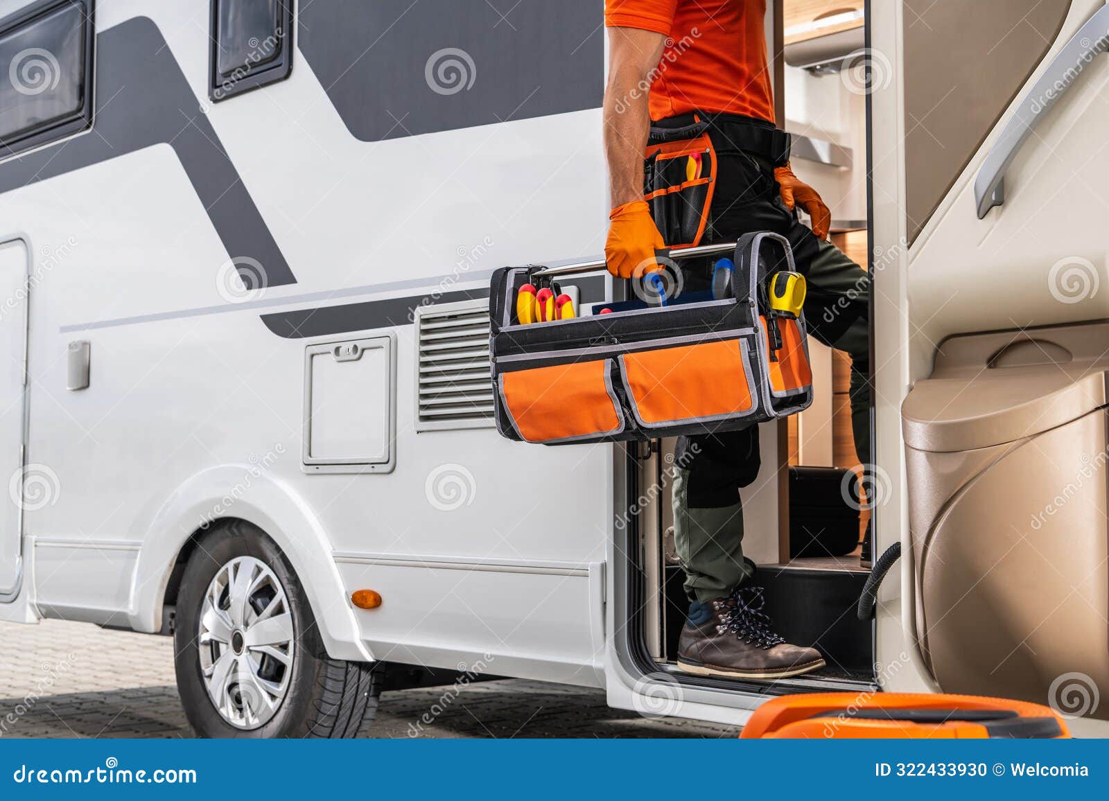 RV Technician Entering a Motorhome with Toolbox Stock Photo - Image of automotive, professional ...