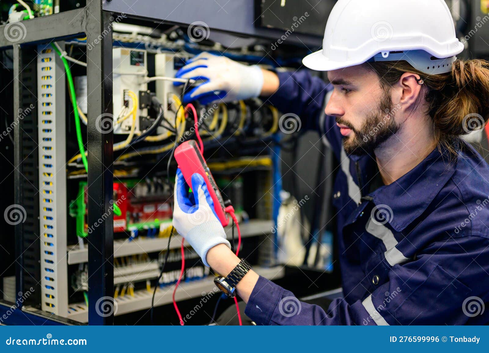 Technician with White Helmet Checking and Repairing Part Stock Photo ...