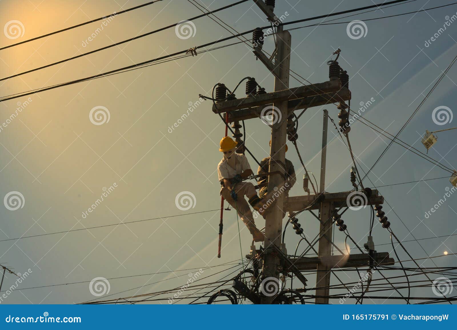 Technician Work on High Voltage Electicity Pole with Copy Space and ...