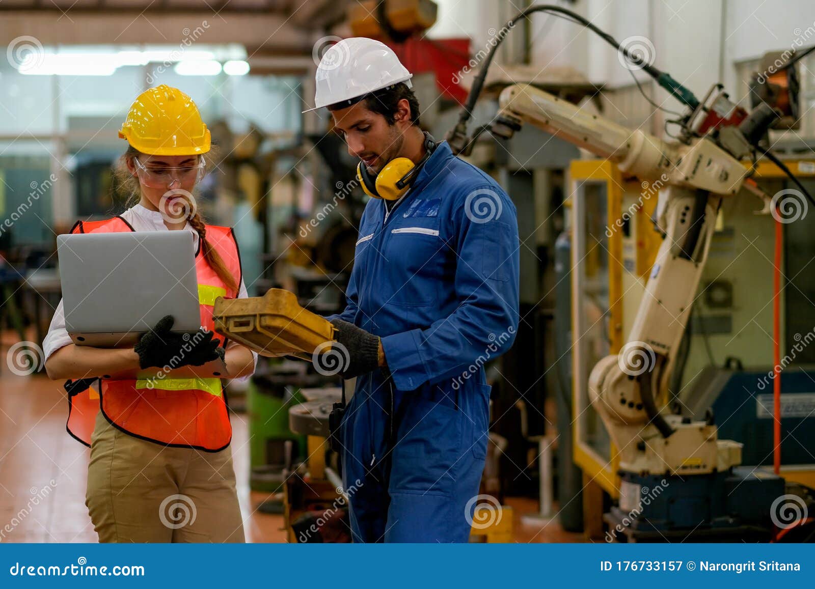 Technician or Worker Man and Woman Discussion about Robot Working in ...