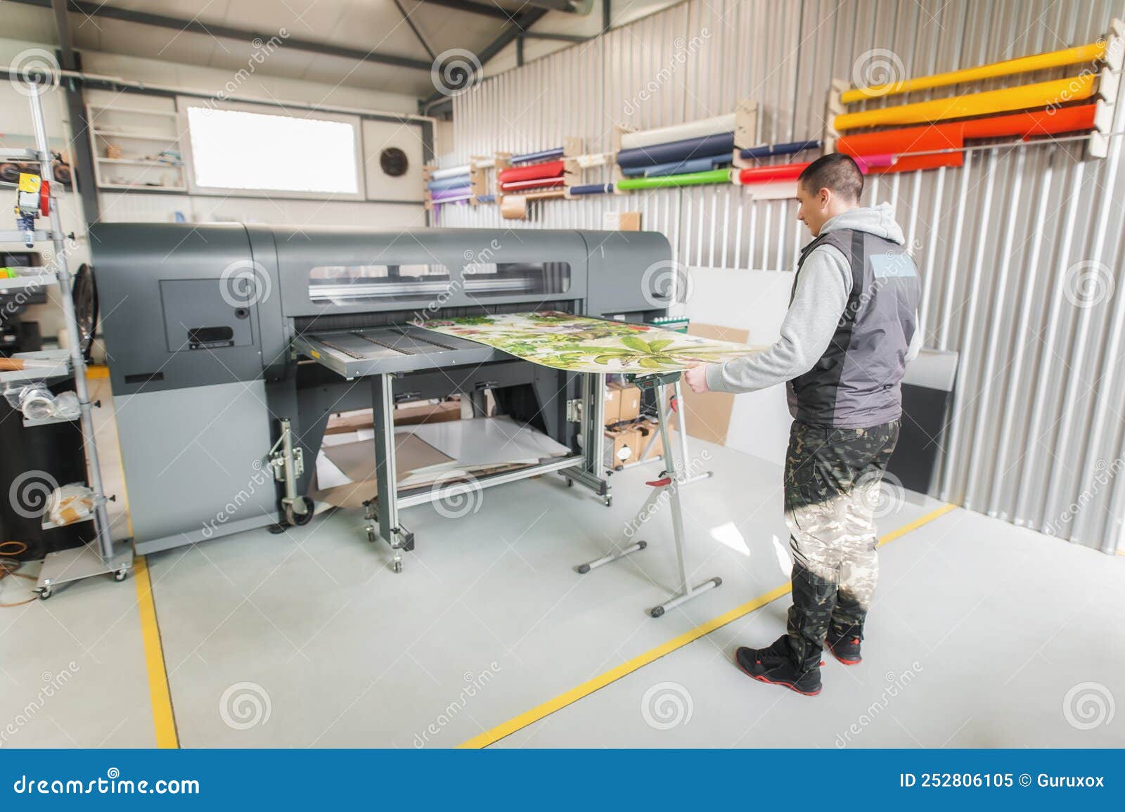 Technician Operator Works on Large Premium Industrial Printer Plotter ...