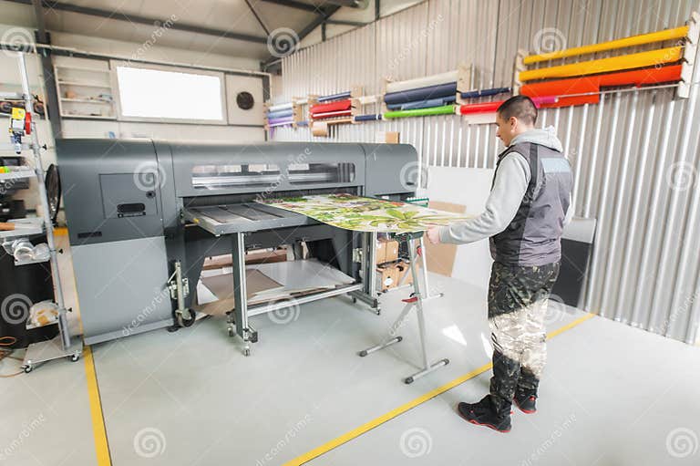 Technician Operator Works on Large Premium Industrial Printer Plotter ...